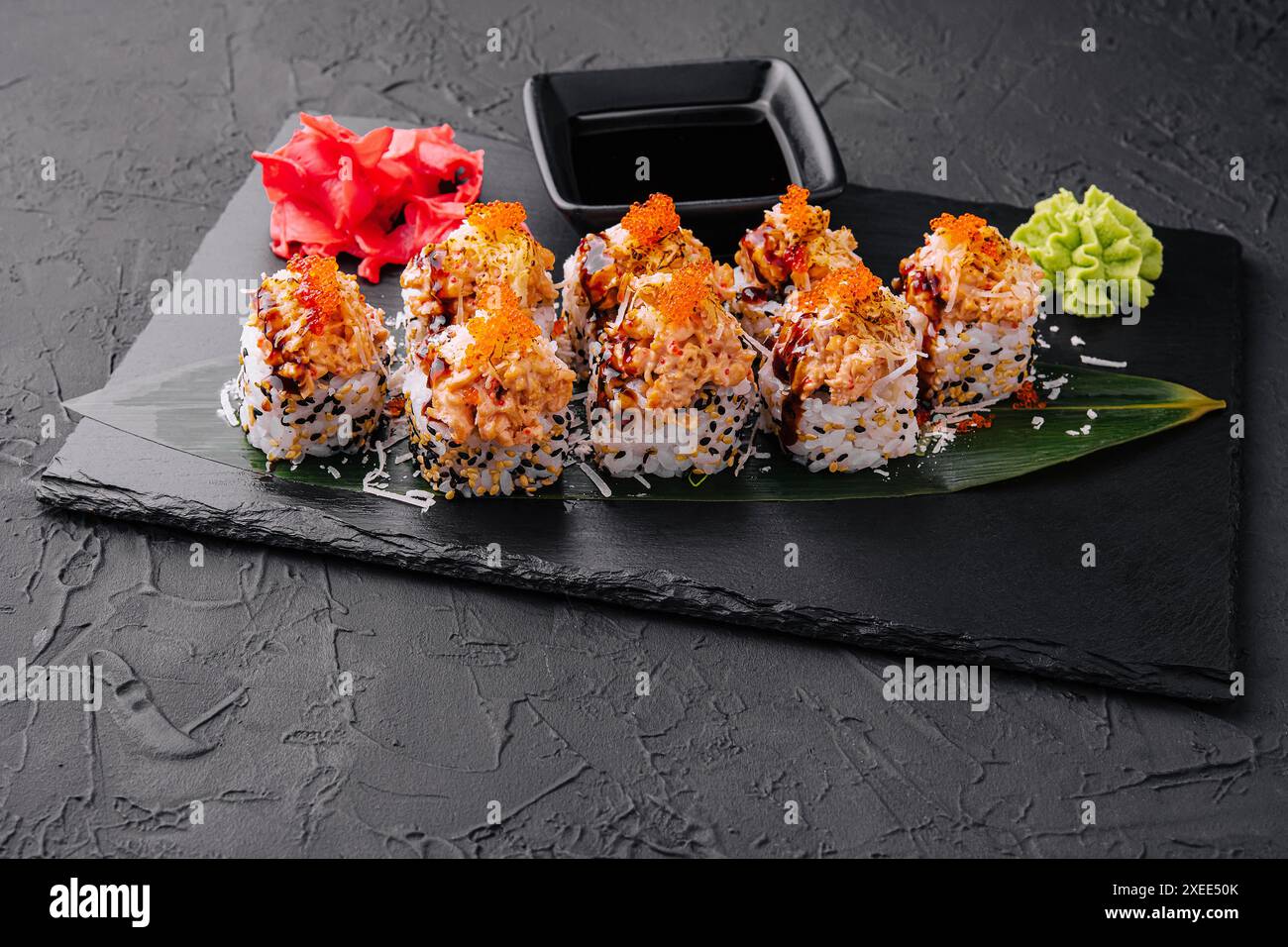 Japanese sushi volcano roll with eel on top and sesame inside Stock ...