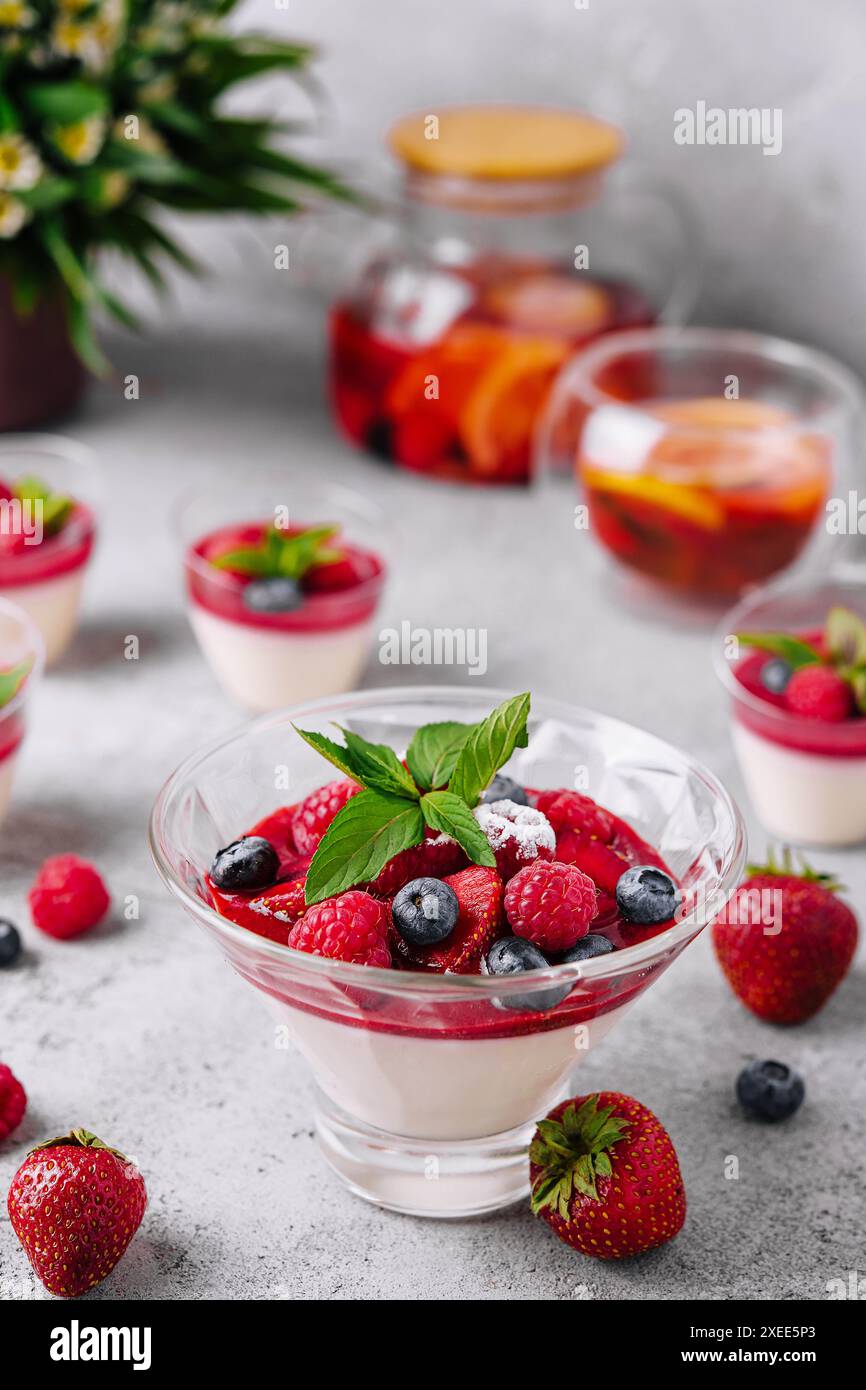 Italian dairy dessert panna cotta with raspberry jam Stock Photo - Alamy
