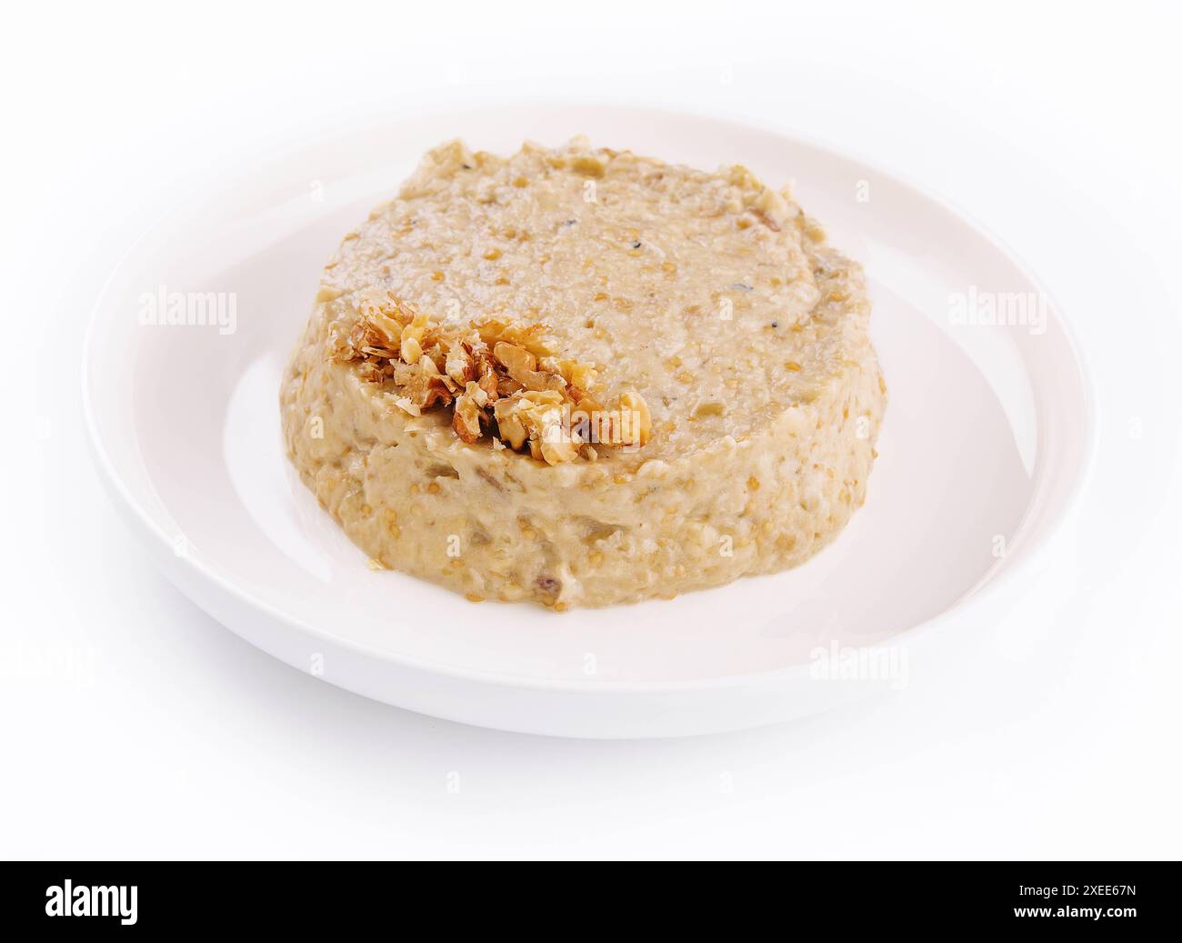 Oatmeal porrige in white plate isolated Stock Photo - Alamy