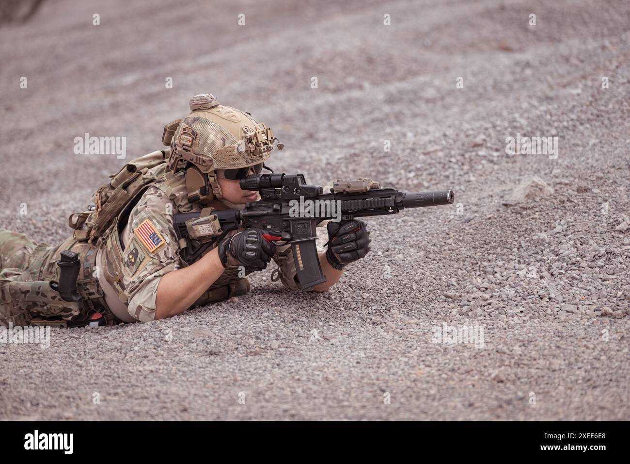Soldiers in camouflage military uniforms carrying weapons ...