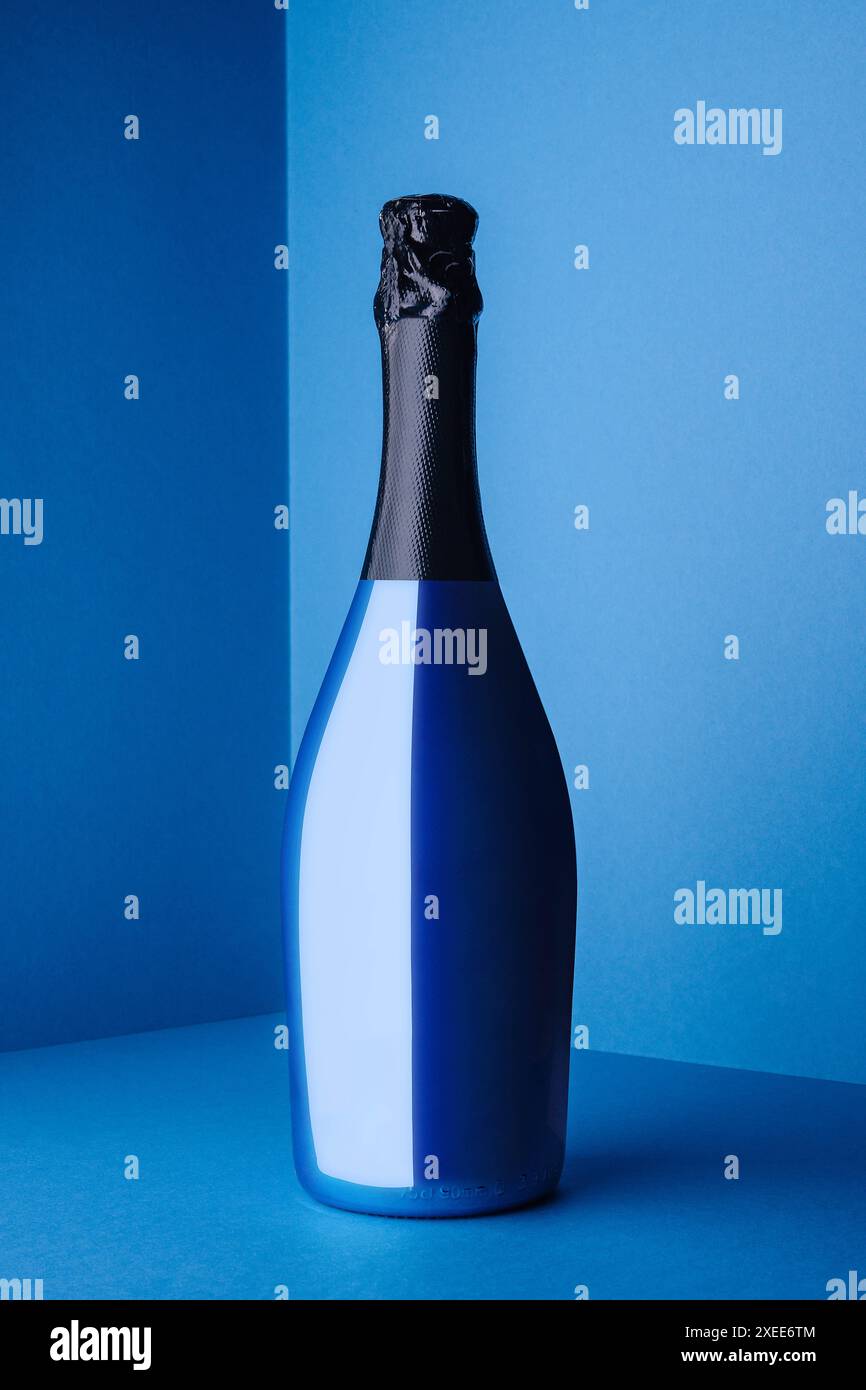 Blue Champagne bottle on light blue background Stock Photo - Alamy