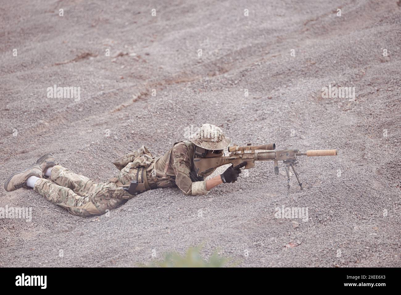 Soldiers in camouflage military uniforms carrying weapons ...