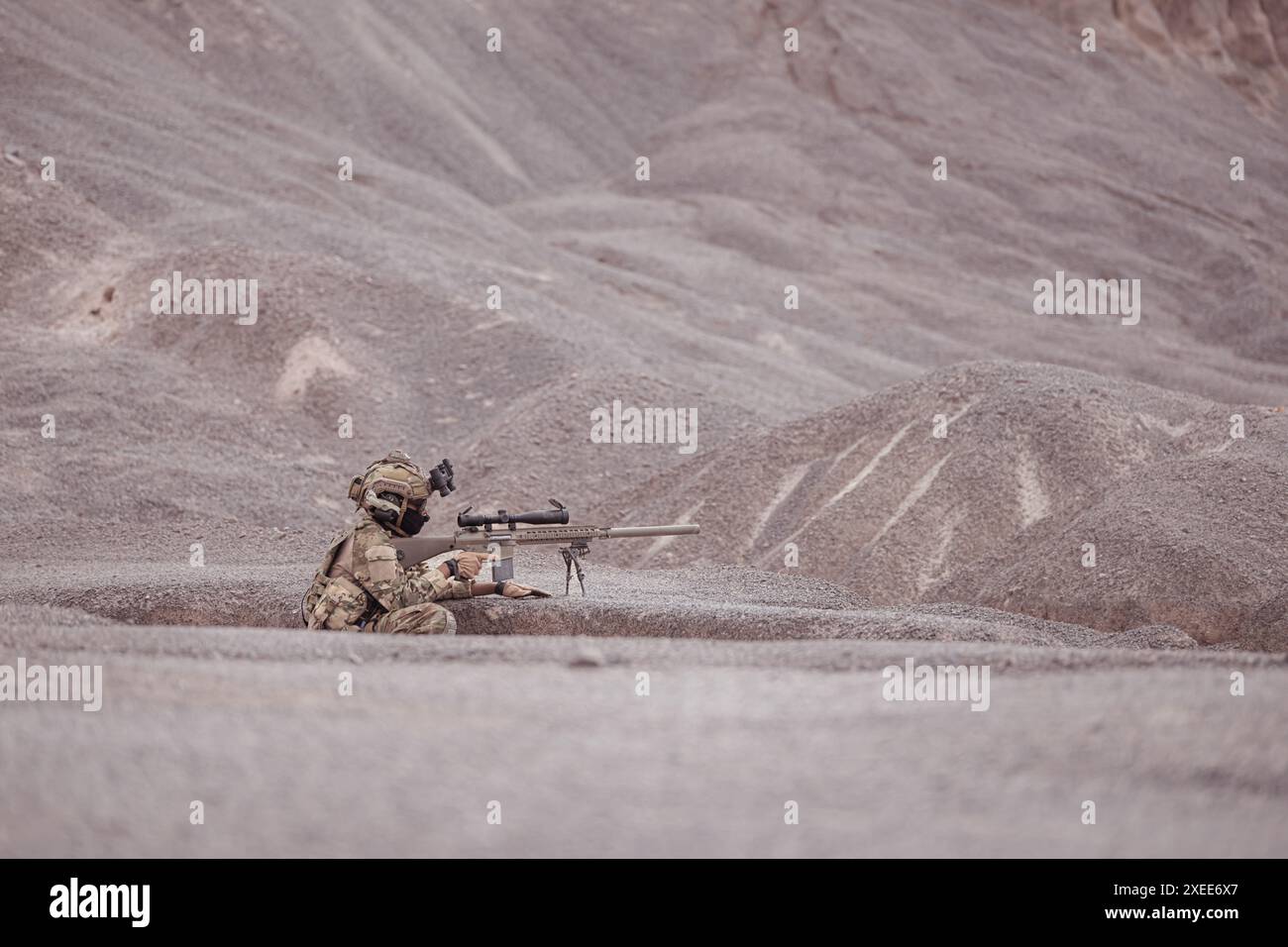 Soldiers in camouflage military uniforms carrying weapons ...