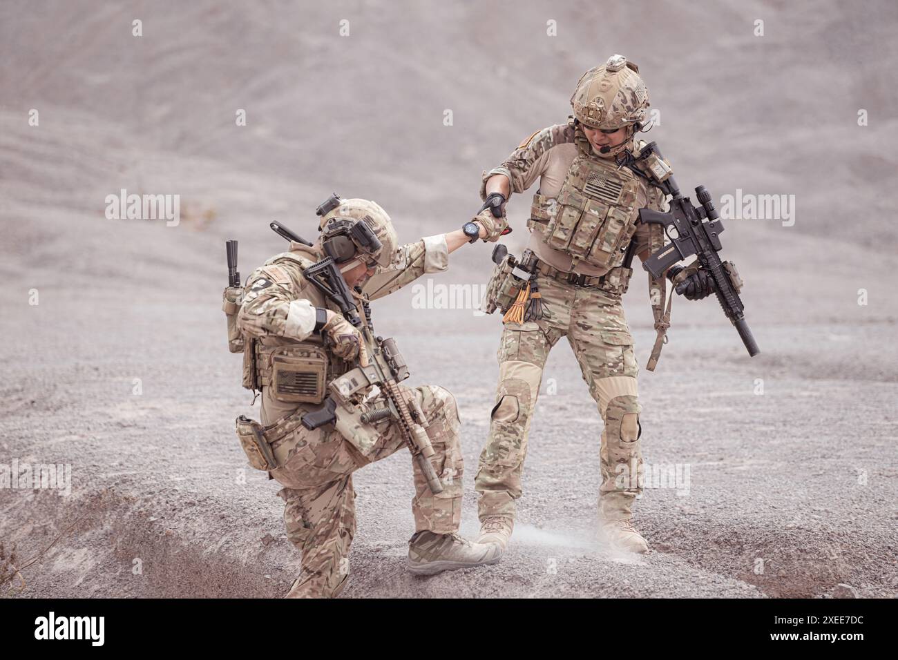 Soldiers in camouflage military uniforms carrying weapons ...