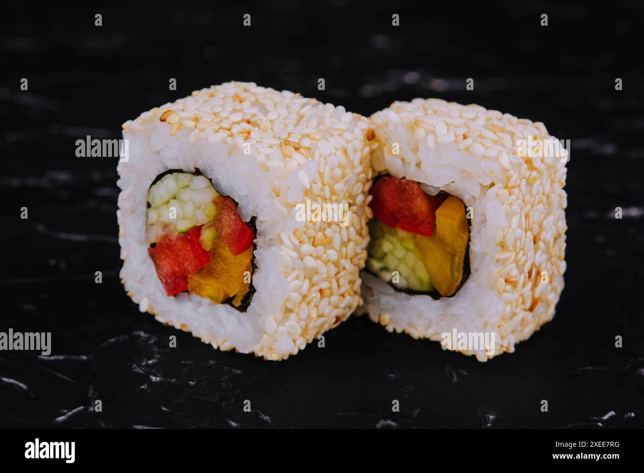 vegan sushi rolls with sesame seeds, peppers and cucumbers Stock Photo ...