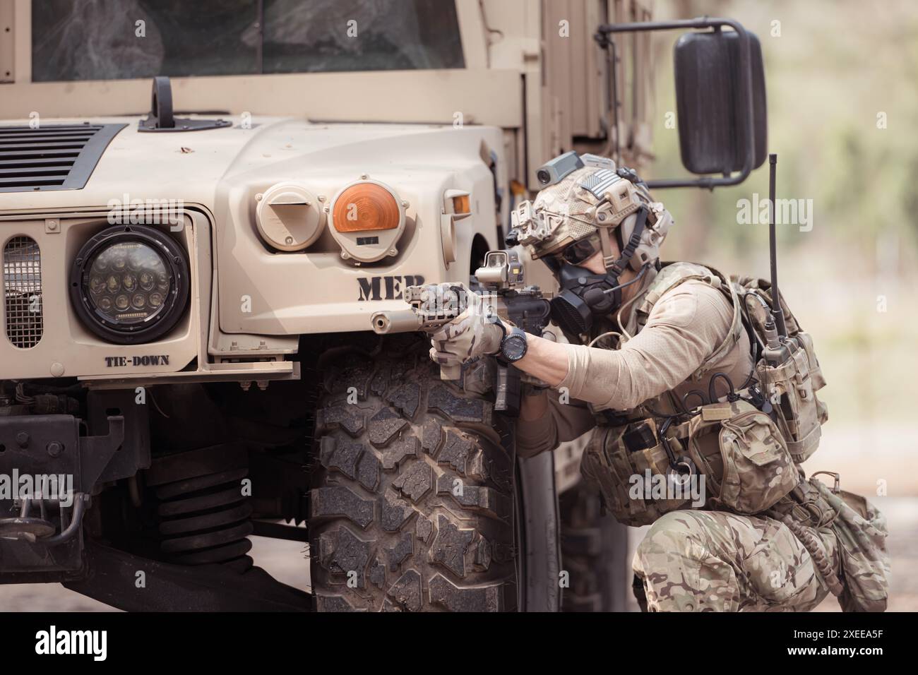 Soldiers in camouflage uniforms hold weapons ready to fire, By hiding ...
