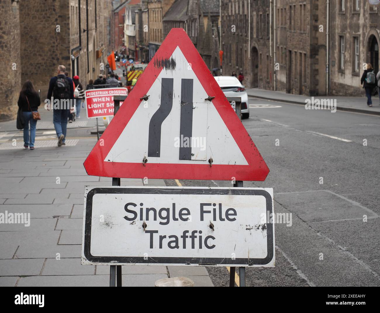 Single file traffic sign Stock Photo - Alamy