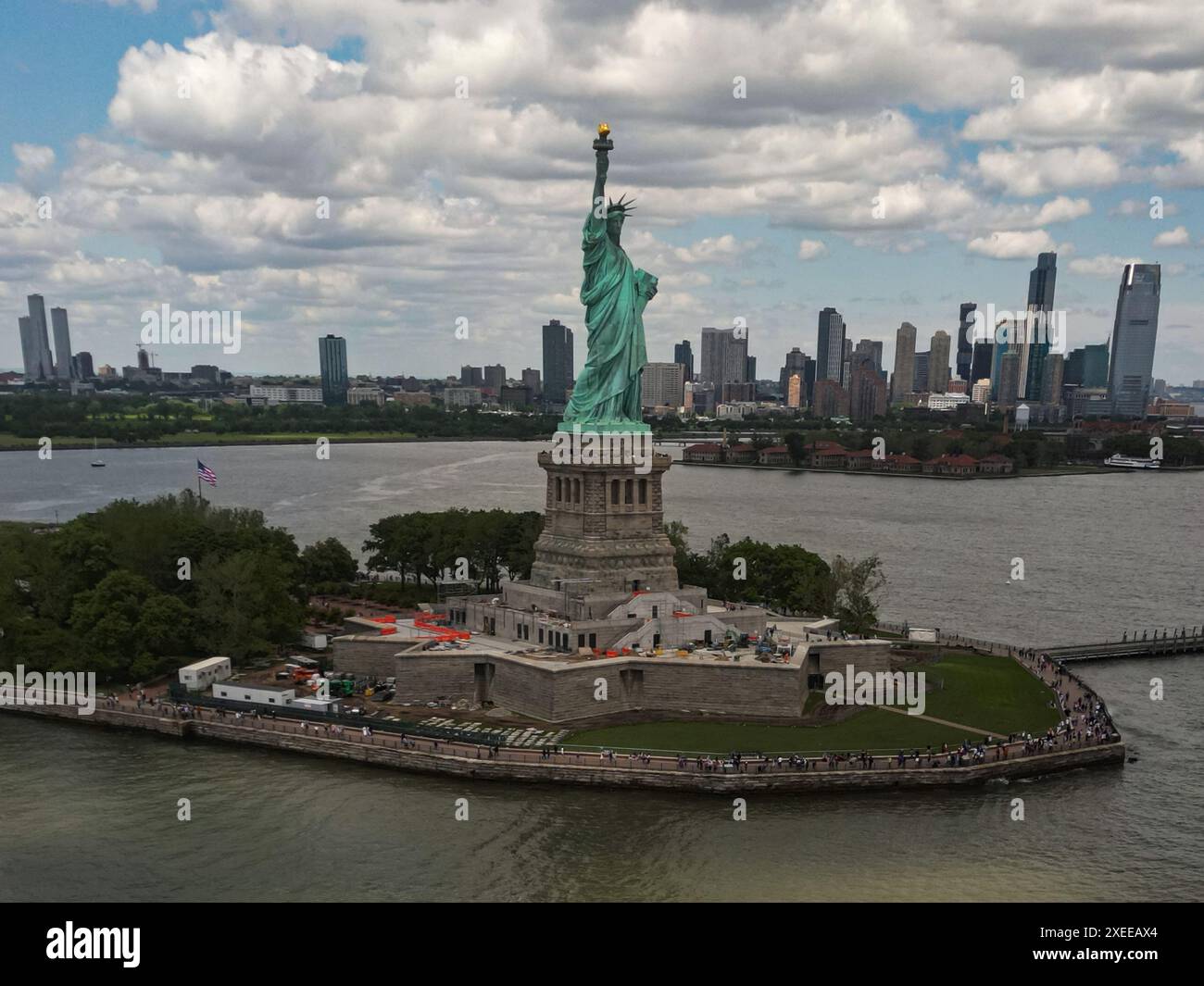 The Statue of Liberty over the Panorama of New York cityscape. New York ...