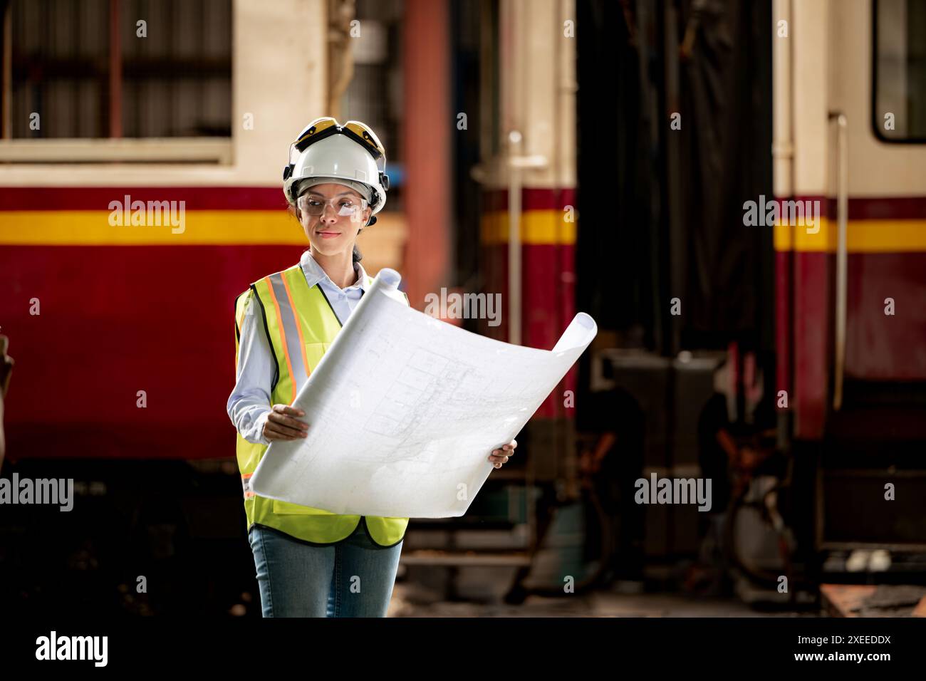 Portrait of railway technician worker in safety vest and helmet working ...