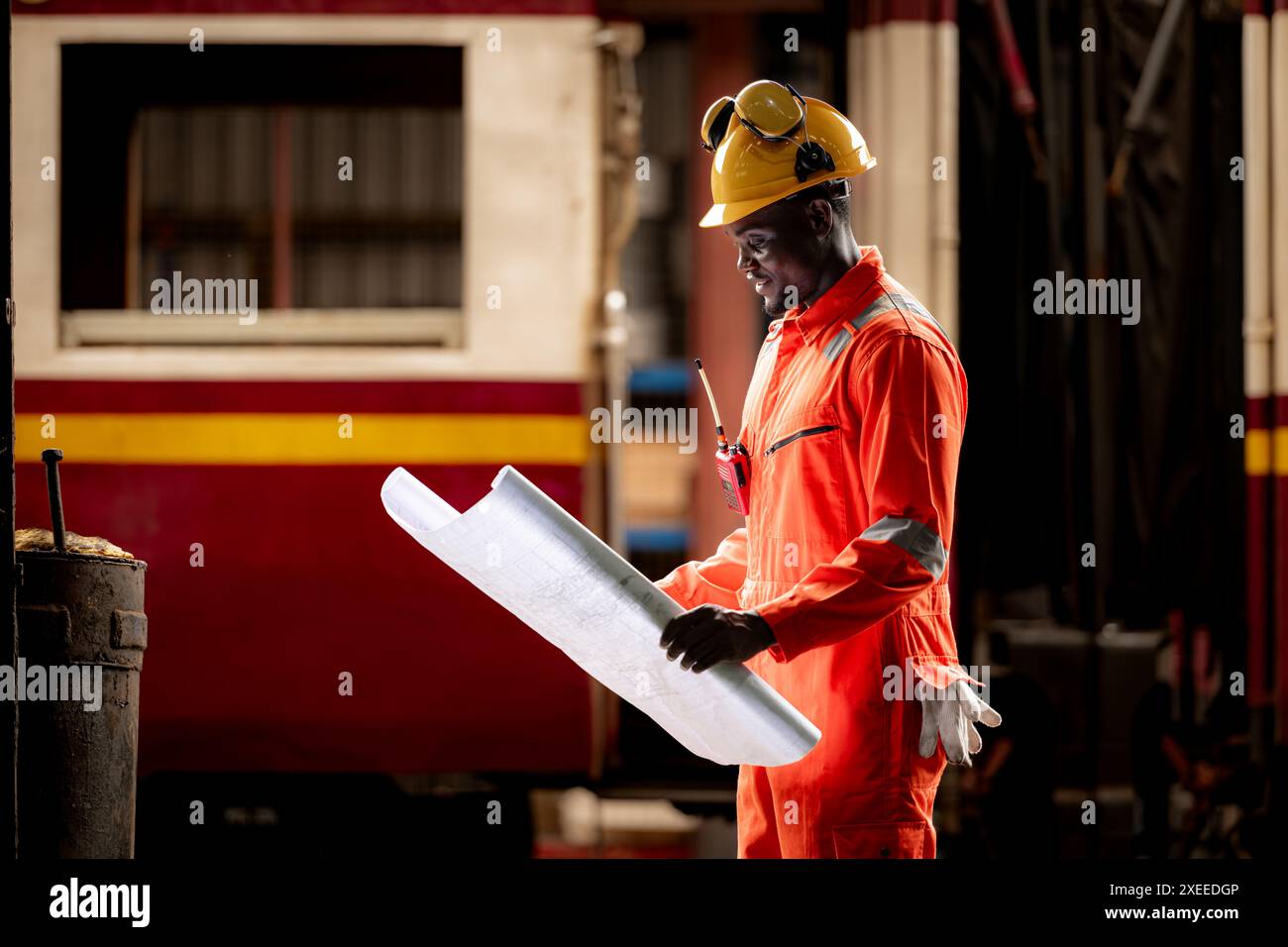 Portrait of railway technician worker in safety vest and helmet working ...