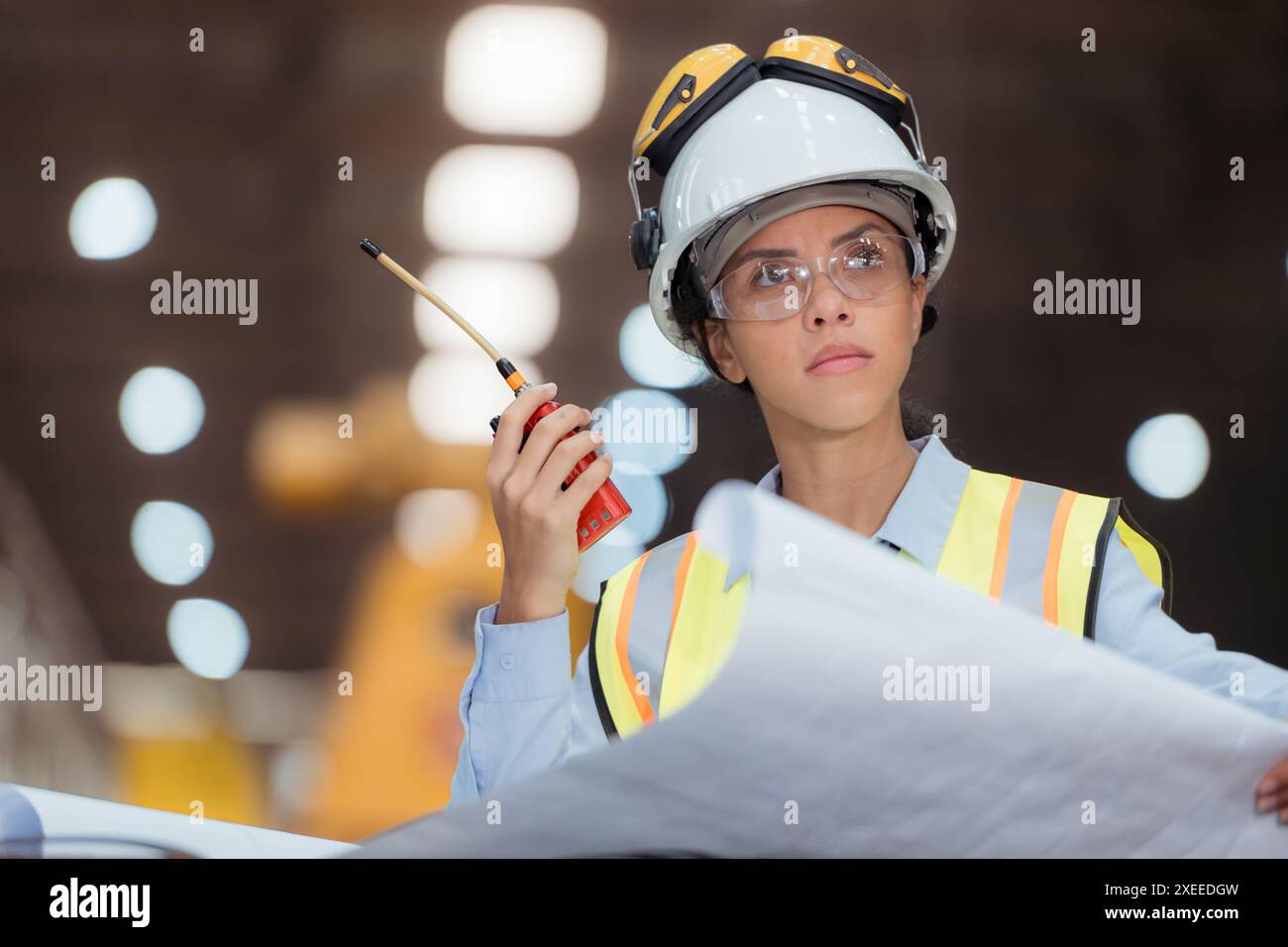 Portrait of railway technician worker in safety vest and helmet working ...