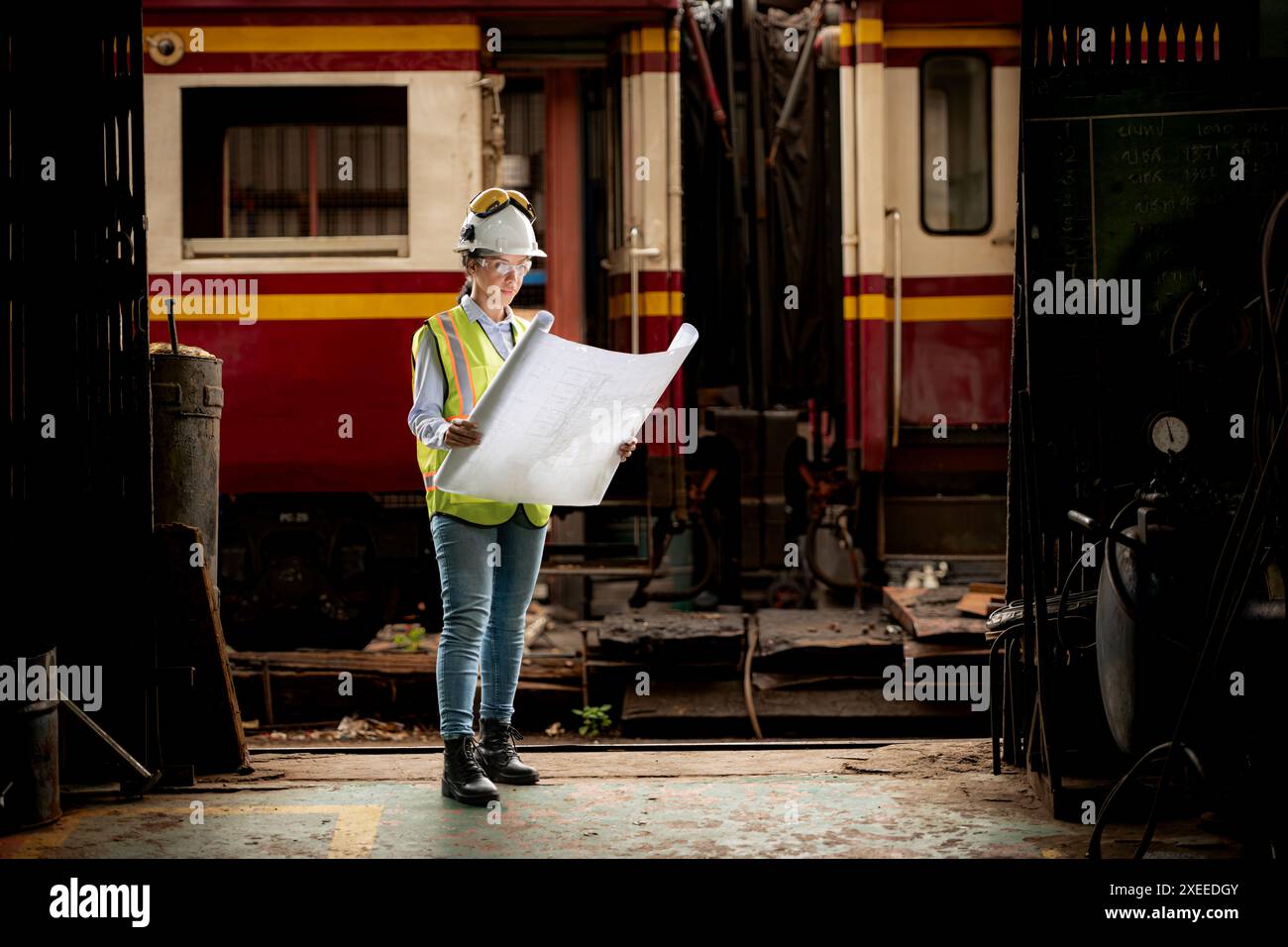 Portrait of railway technician worker in safety vest and helmet working ...