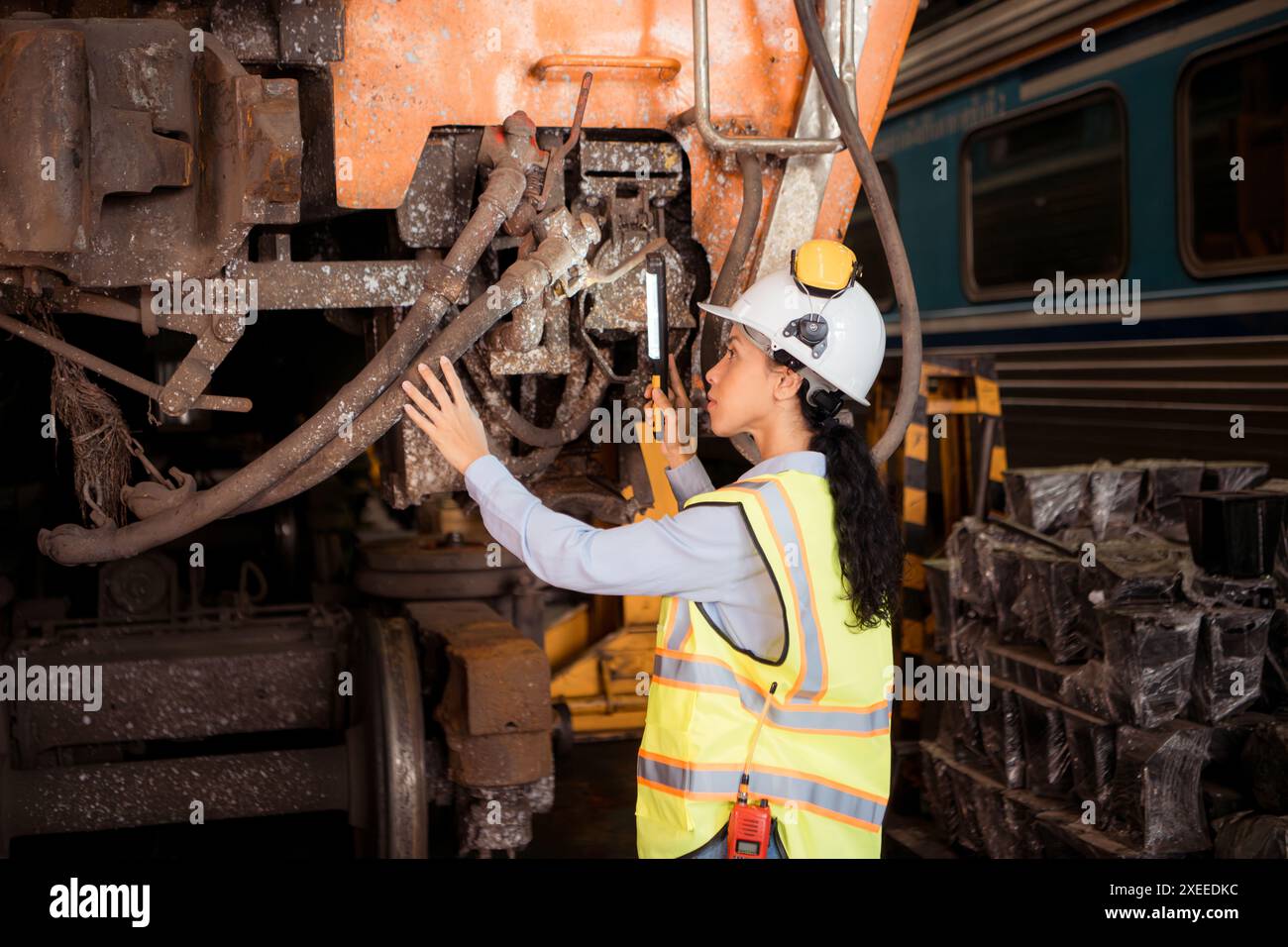 Portrait of railway technician worker in safety vest and helmet working ...