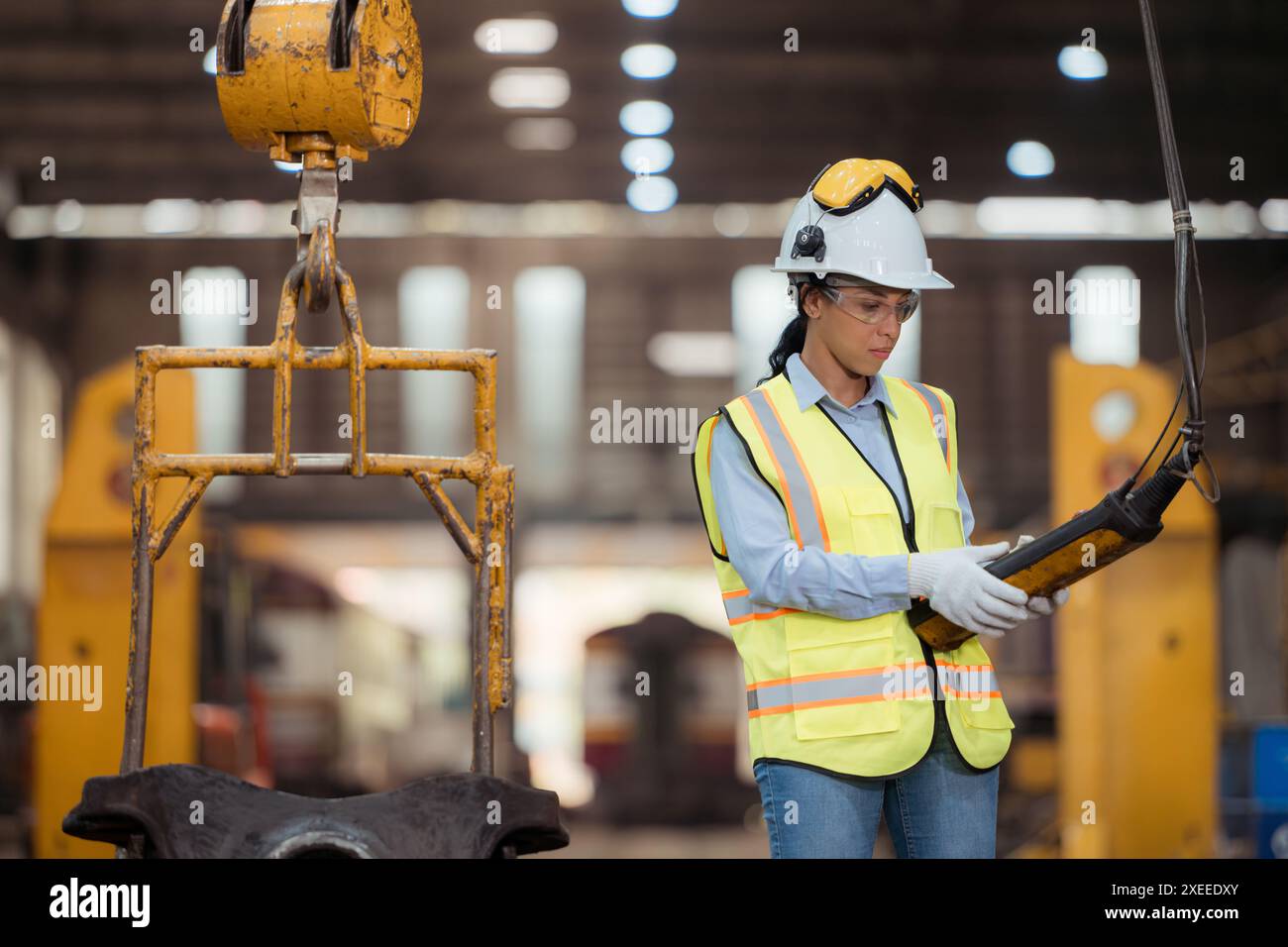 Portrait of railway technician worker in safety vest and helmet working ...