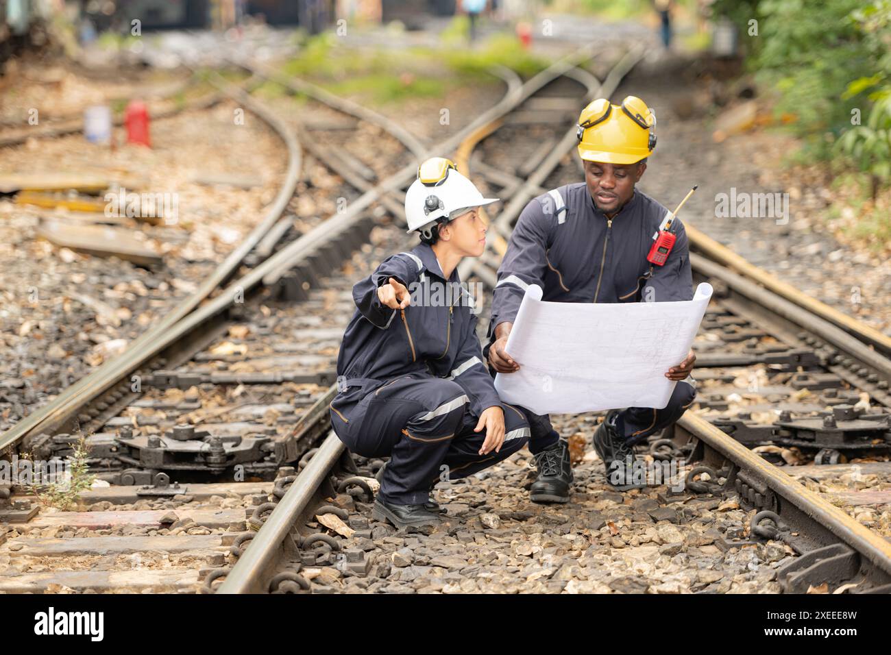 Railway technicians and engineers, Working on the train tracks at train ...