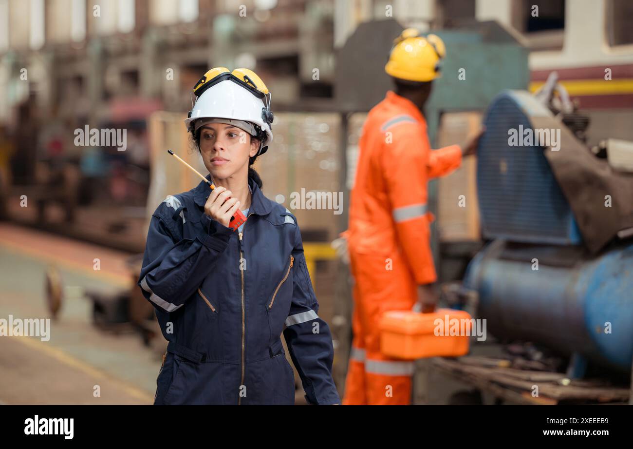 Portrait of railway technician worker in safety vest and helmet working ...