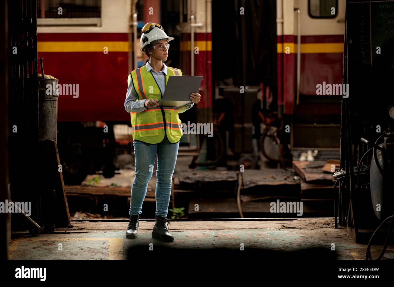 Portrait of railway technician worker in safety vest and helmet working ...