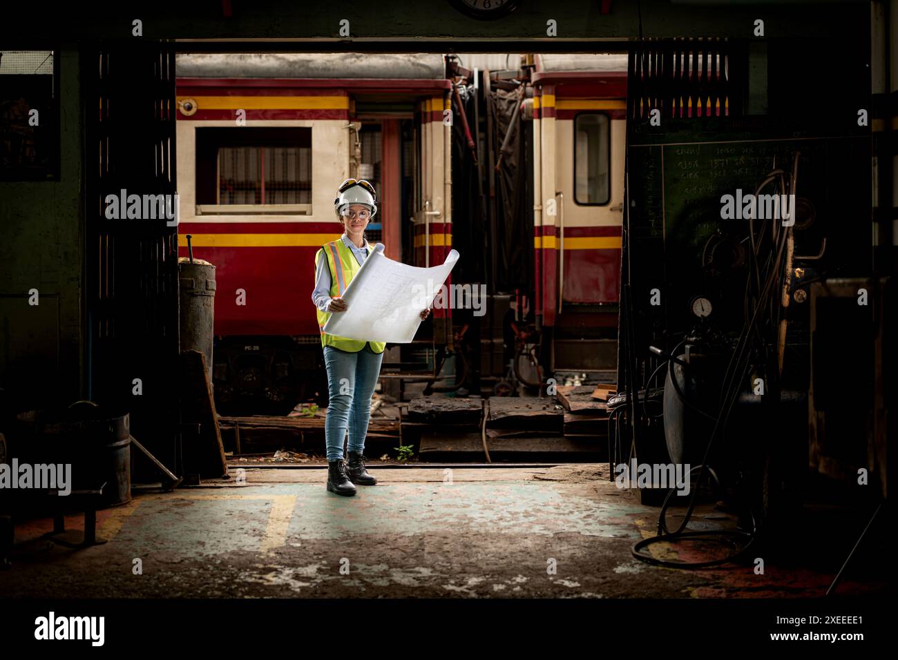 Portrait of railway technician worker in safety vest and helmet working ...