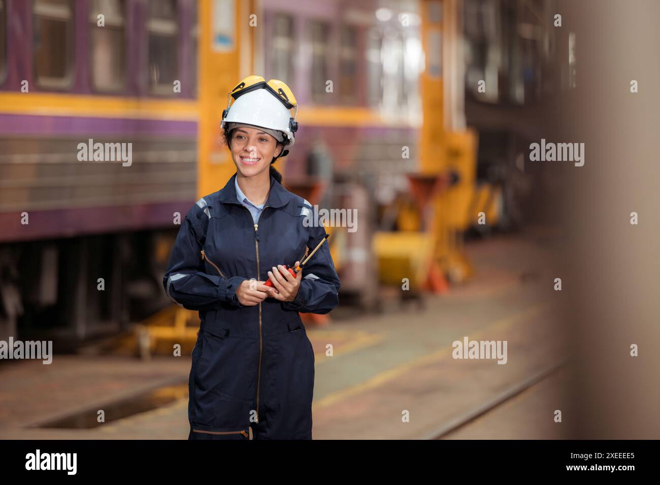 Portrait of railway technician worker in safety vest and helmet working ...