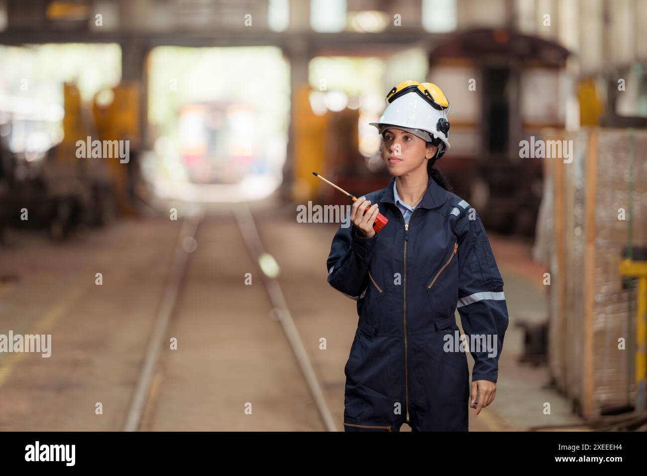 Portrait of railway technician worker in safety vest and helmet working ...