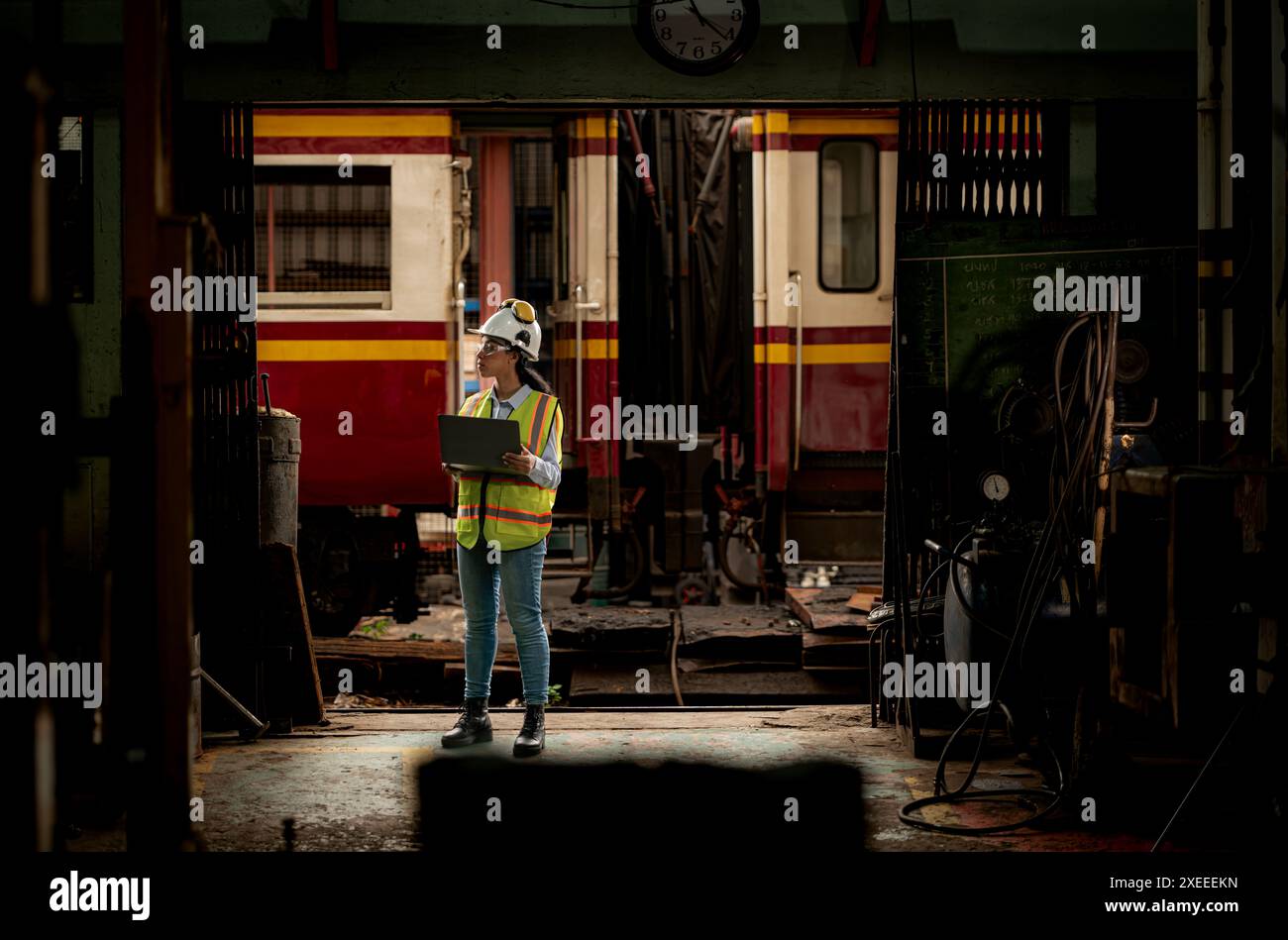Portrait of railway technician worker in safety vest and helmet working ...