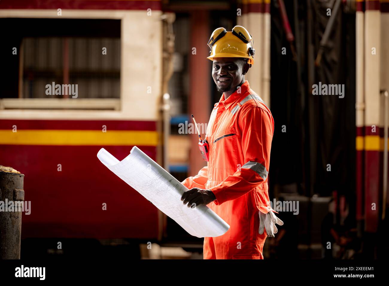 Portrait of railway technician worker in safety vest and helmet working ...