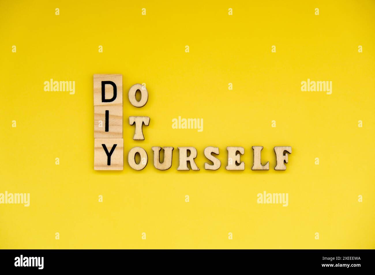 DIY Do It Yourself inscription on yellow background. Handmade home ...