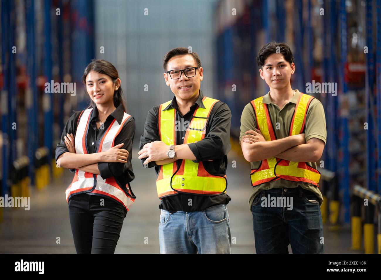 Portrait of group employees in the warehouse with arms crossed Stock ...