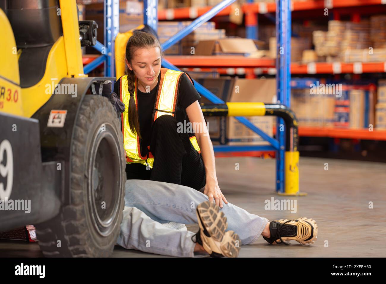 A warehouse employee suffered a leg accident at work Stock Photo - Alamy