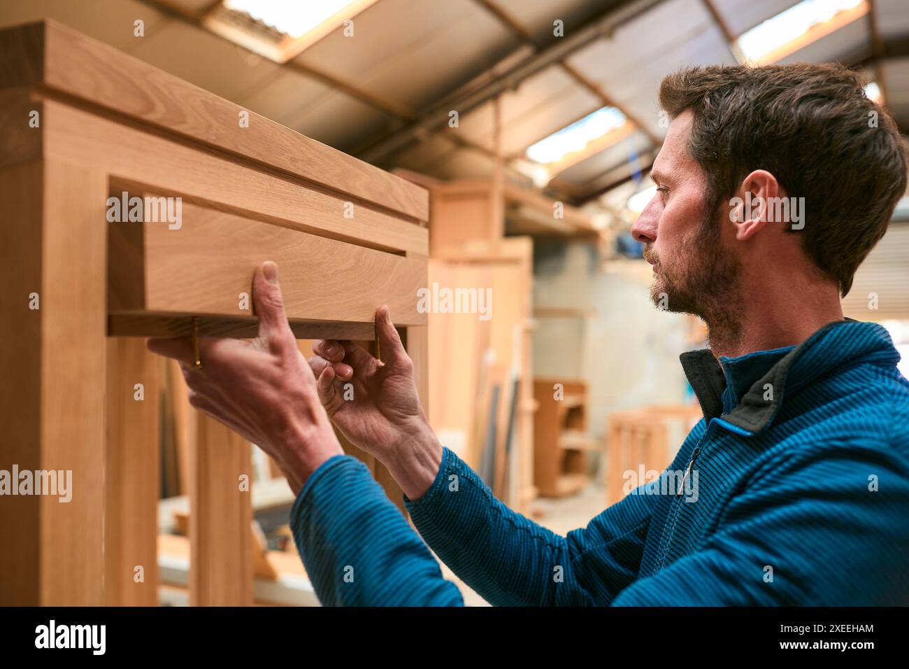 Carpenter In Workshop Gluing Wood To Window Frame Stock Photo - Alamy