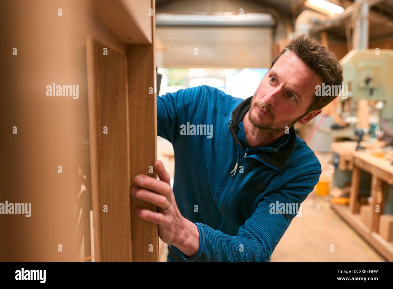 Carpenter In Workshop Measuring Wooden Window Frame Stock Photo - Alamy