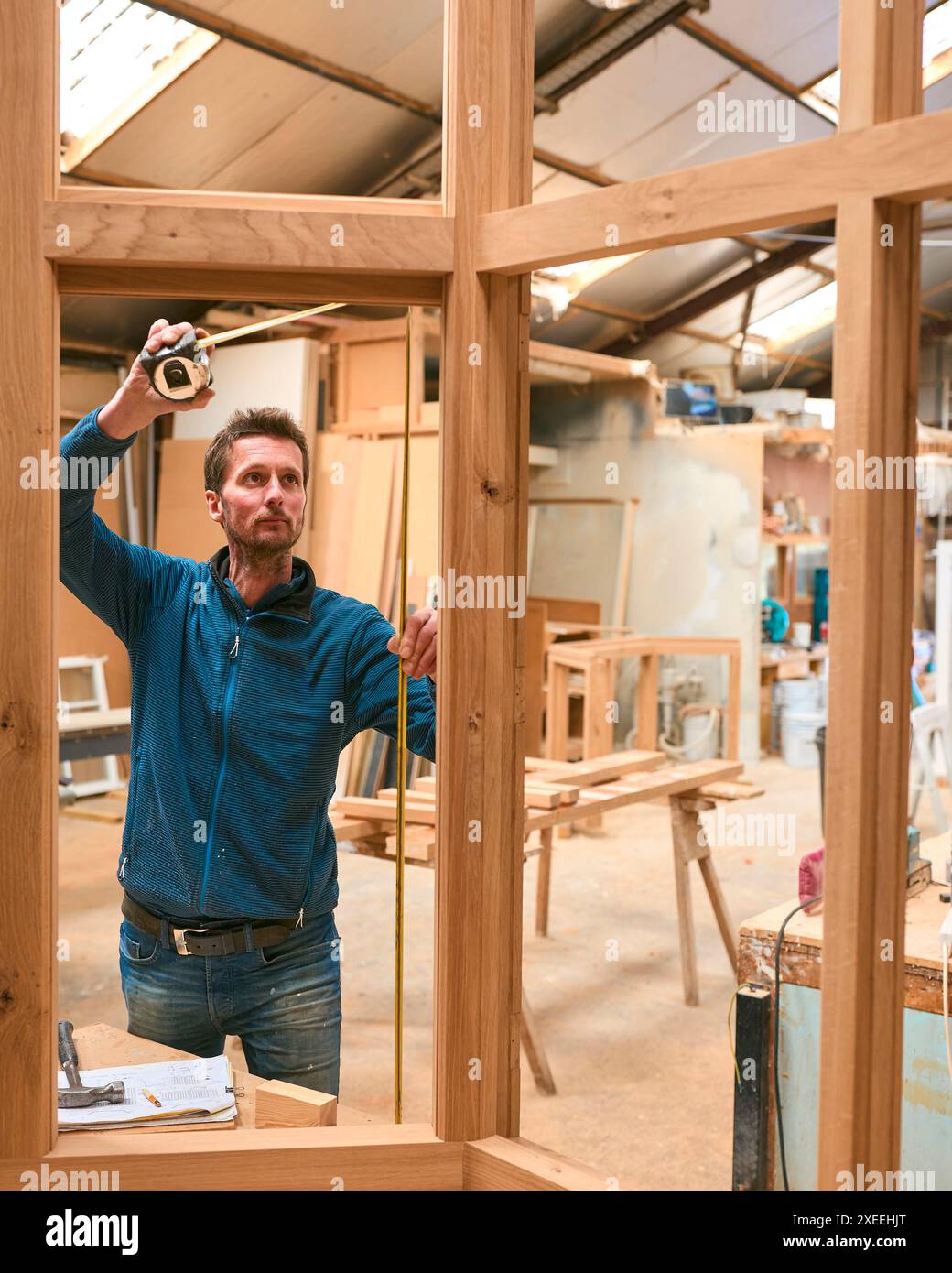 Carpenter In Workshop Measuring Wooden Window Frame Stock Photo - Alamy