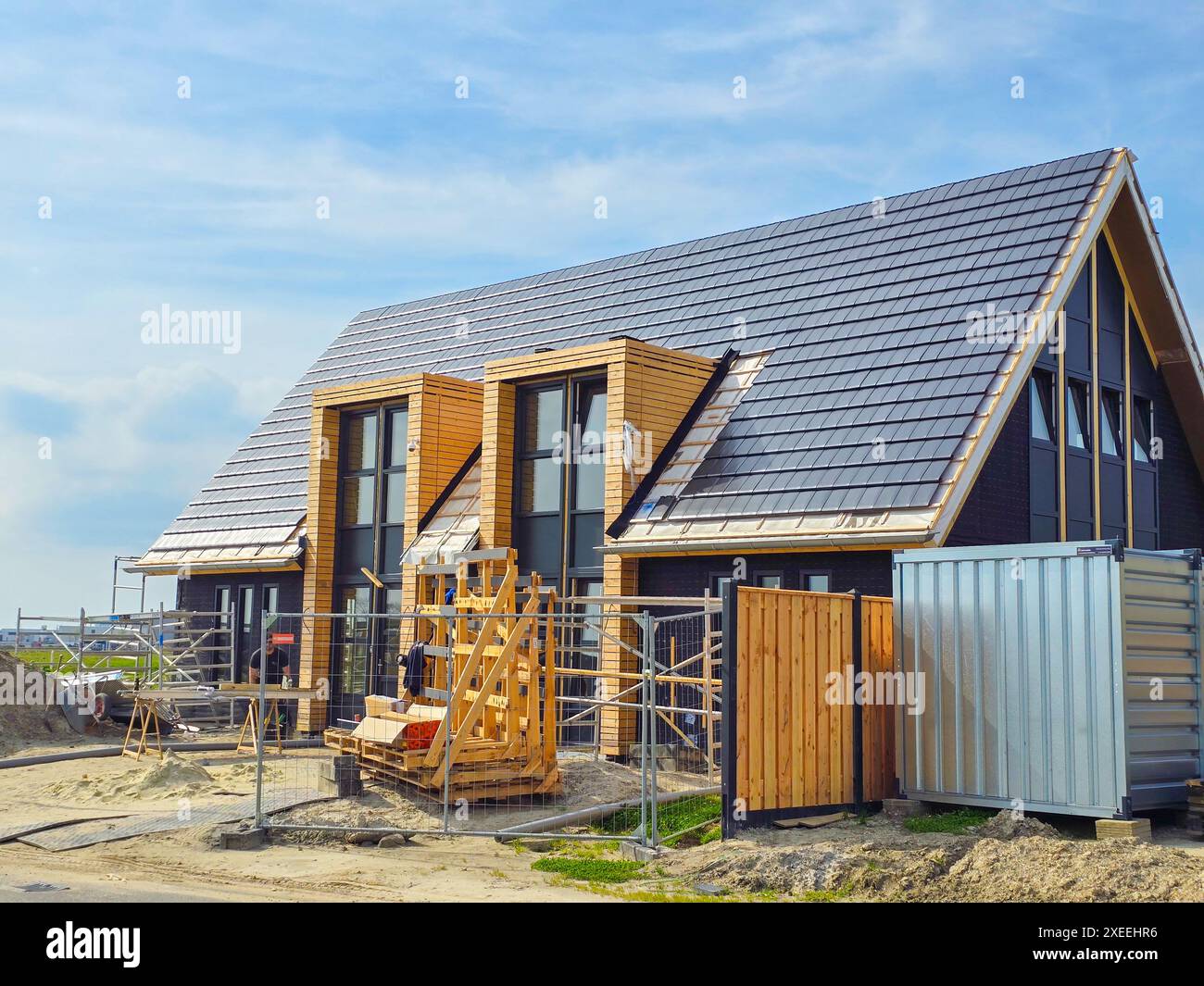 Construction site of a new Dutch Suburban area with modern family ...