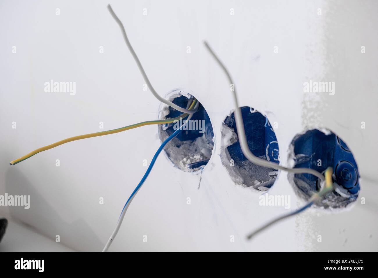 Apartment renovation. Electrical wiring. Wires sticking out of the wall ...