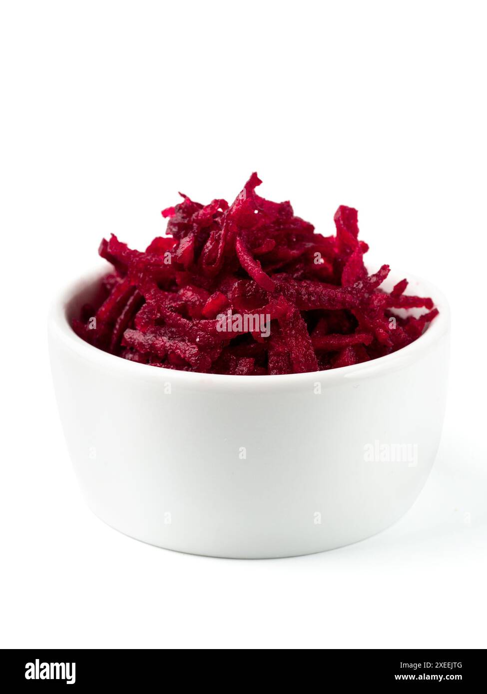 Grated beetroot in ceramic bowl isolated on white Stock Photo - Alamy