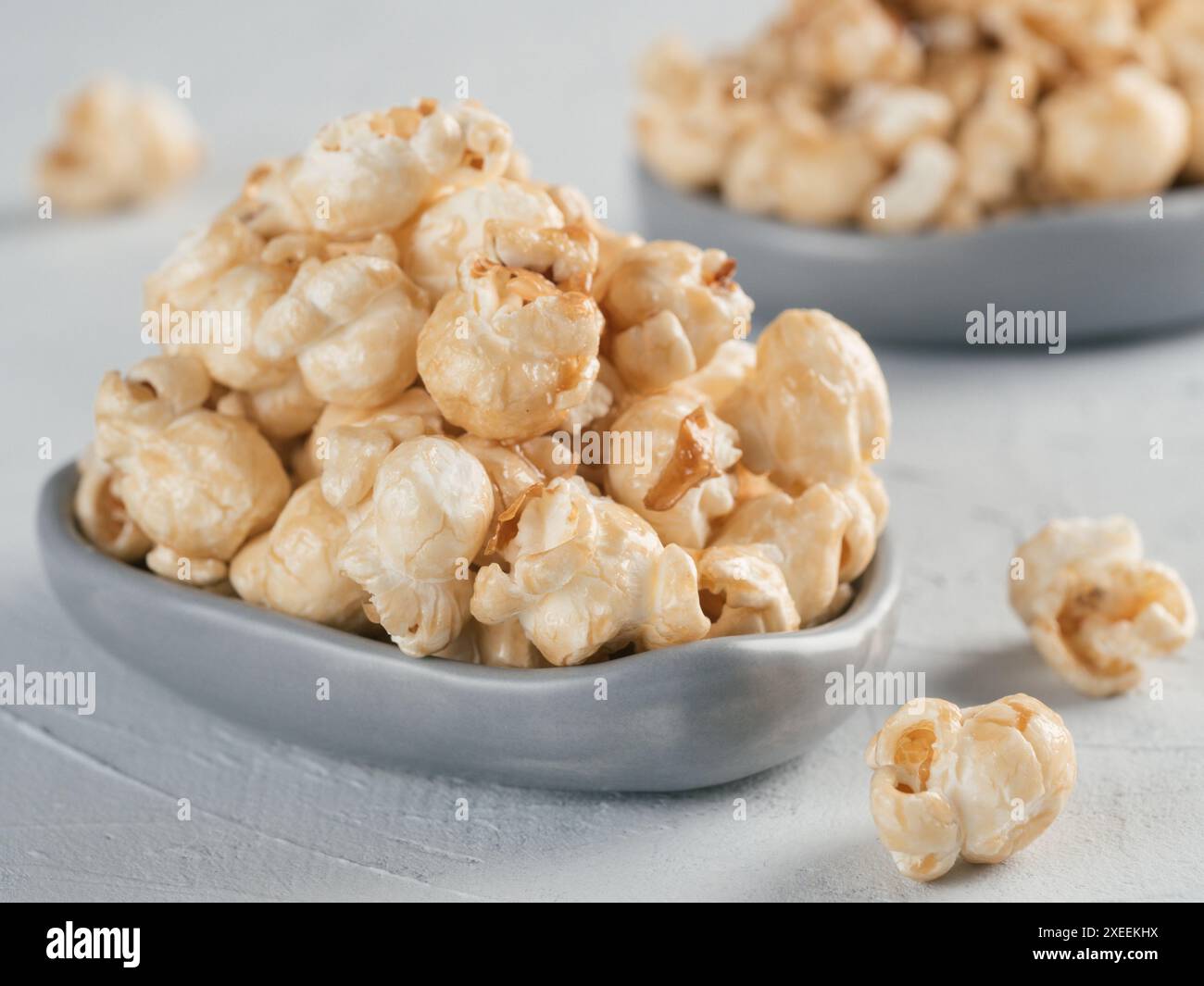 Popcorn on gray concrete background Stock Photo - Alamy