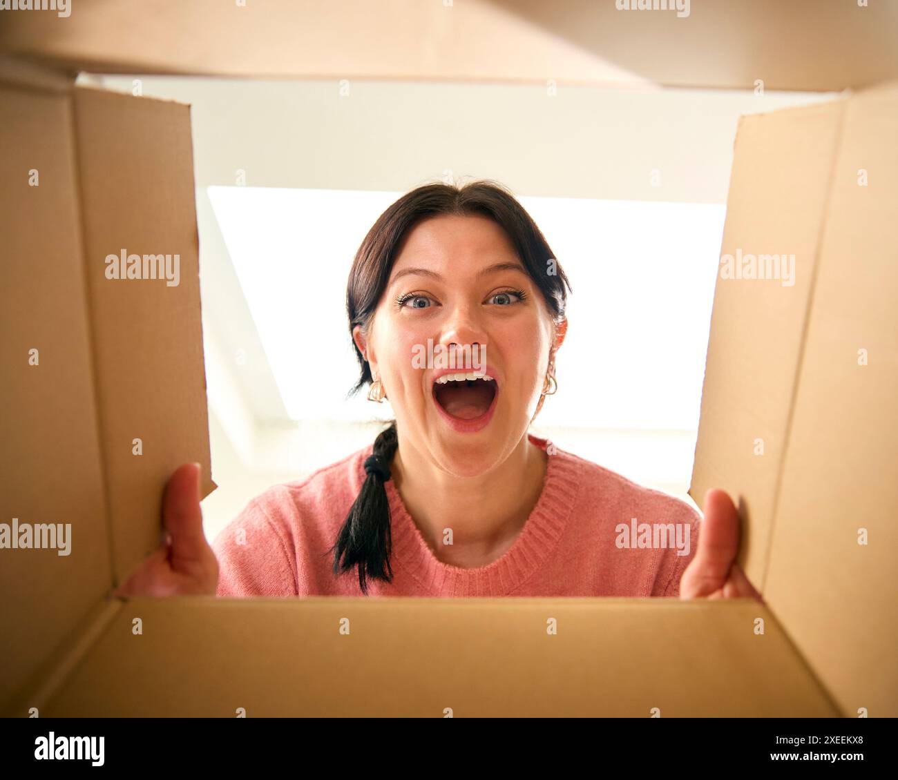 Excited woman opening shopping hi-res stock photography and images - Alamy