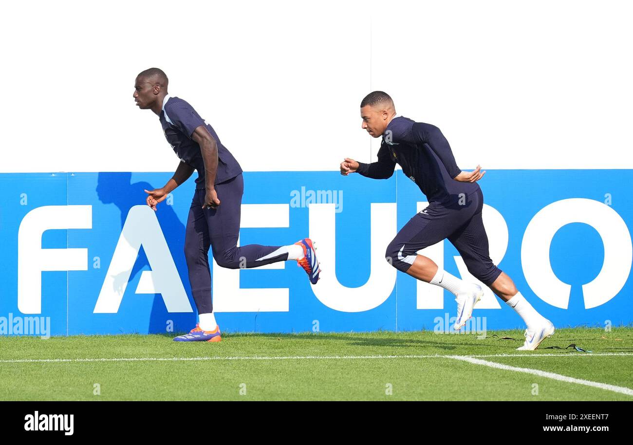 France's Ferland Mendy (left) and Kylian Mbappe during a training ...