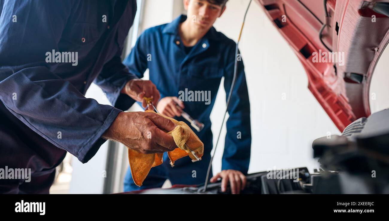 Close up male mechanic servicing hi-res stock photography and images ...