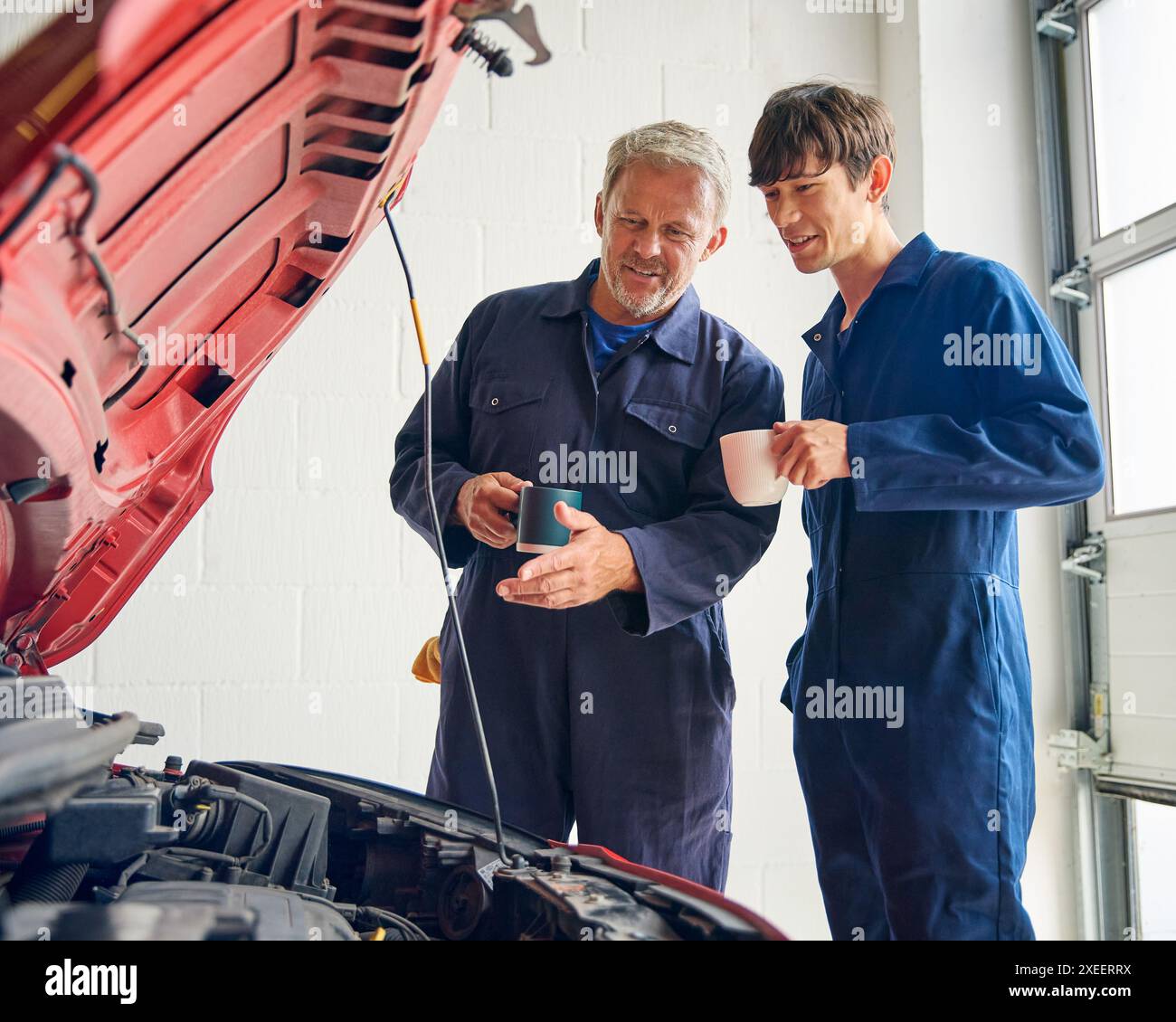 Two men auto repair shop hi-res stock photography and images - Alamy