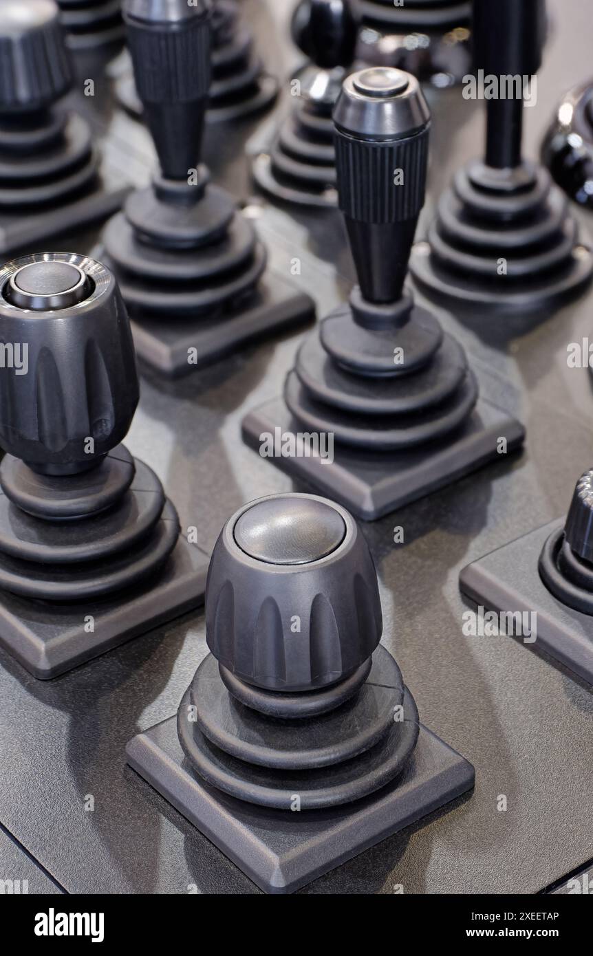 Big group of various control sticks on a black dashboard Stock Photo ...