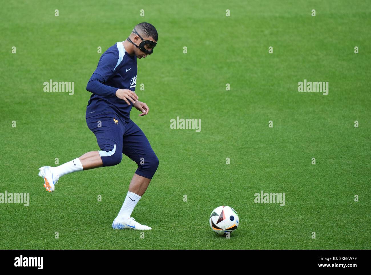 France's Kylian Mbappe wearing his protective mask during a training ...