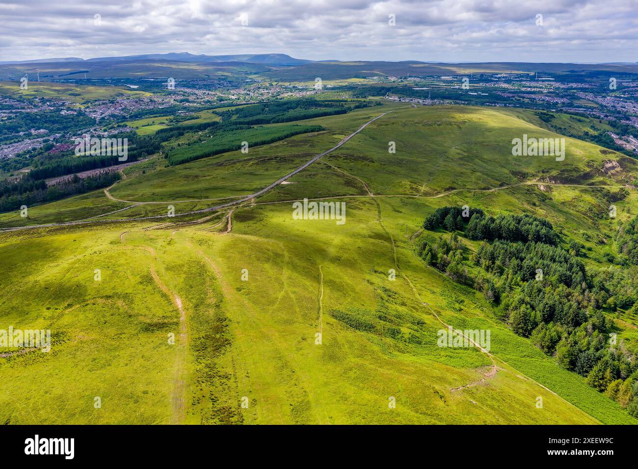 Aerial view of lush green valleys and small towns (South Wales, UK ...
