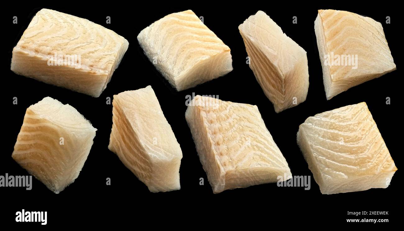 Fresh fish fillet pieces on black background Stock Photo - Alamy