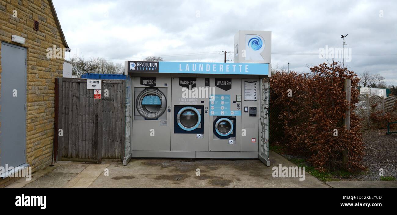 Launderette outside shop rear business place clothes clothing wash ...