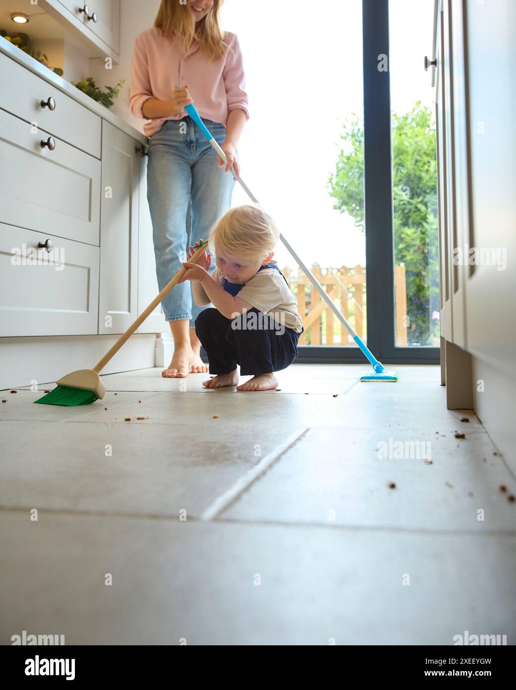 Children sweeping hi-res stock photography and images - Alamy