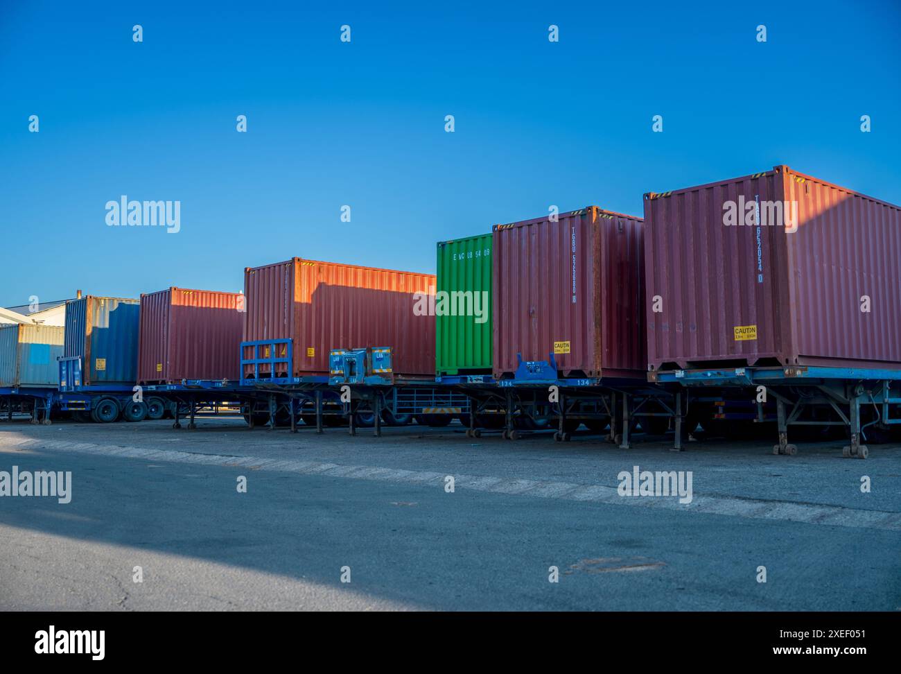 Industrial container cargo freight on truck Stock Photo - Alamy