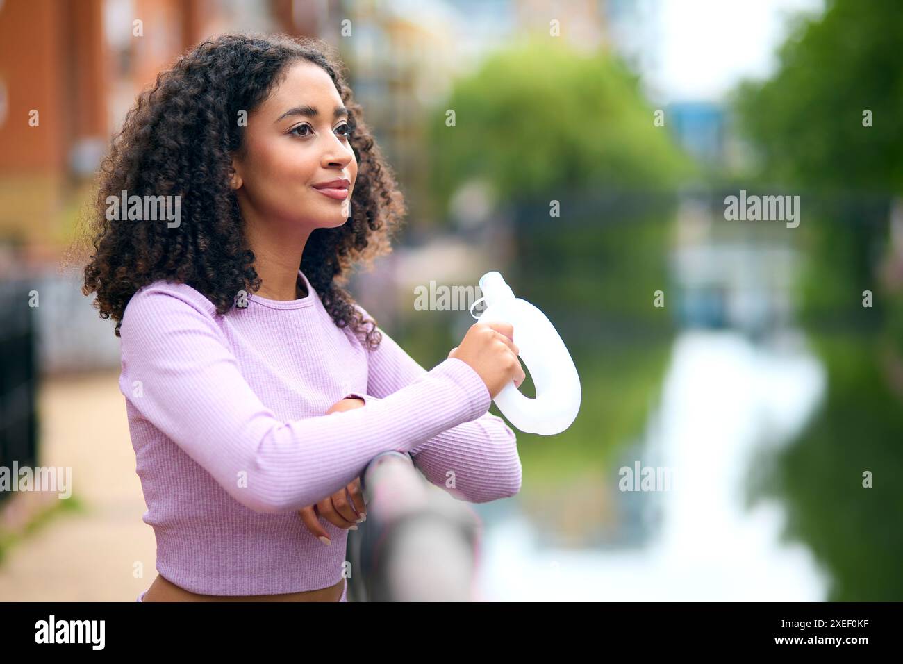 Woman Wearing Fitness Clothing Drinking Water During Exercise Running ...