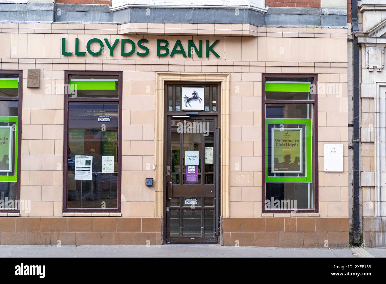 Front entrance of a traditional Lloyds Bank branch on a UK high street ...