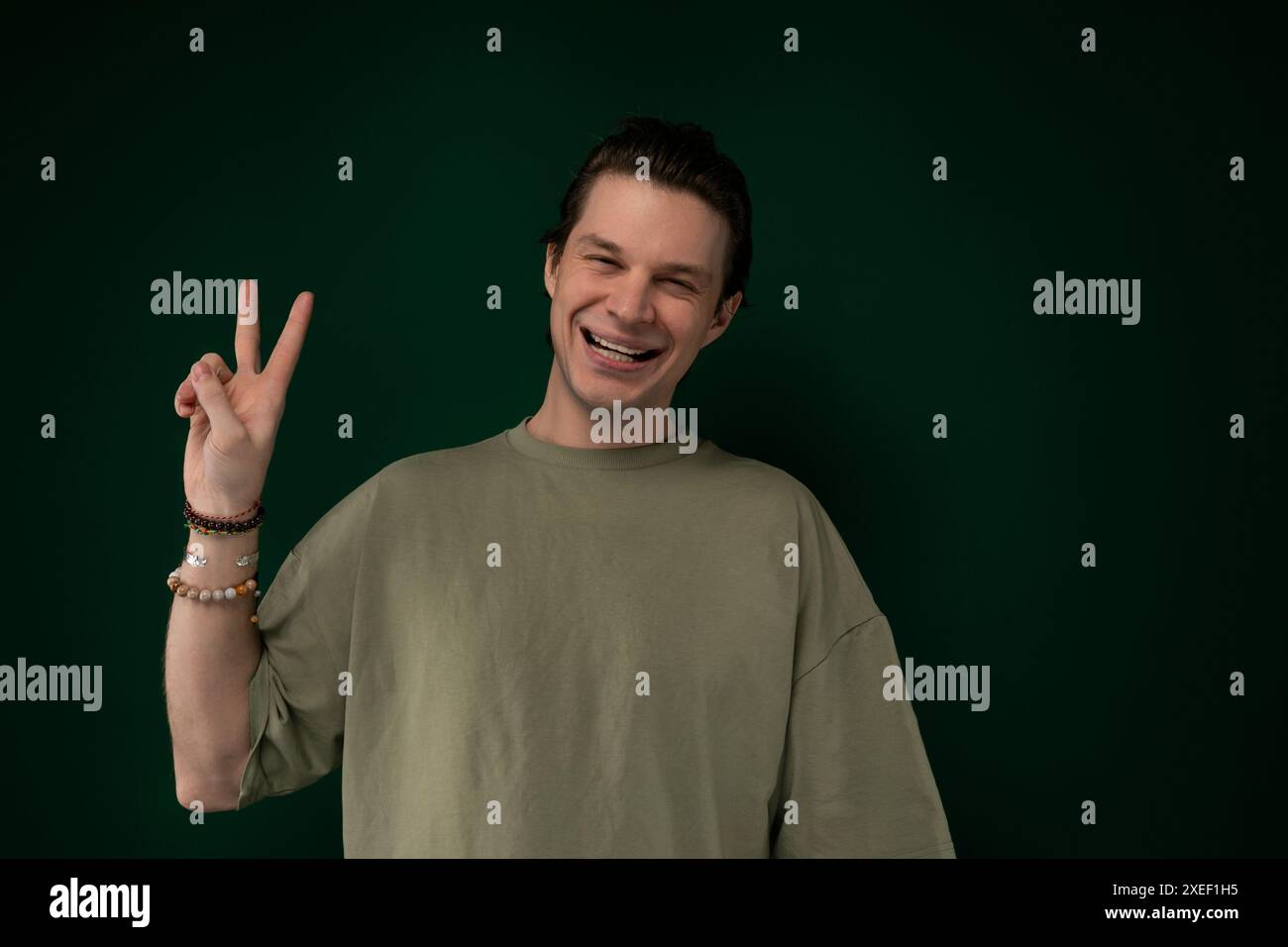 Man making peace sign hi-res stock photography and images - Alamy